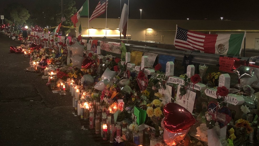 People continue to visit the growing memorial at the site of Saturday's ...